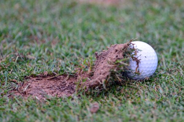 Golf ball under a divot | National Club Golfer